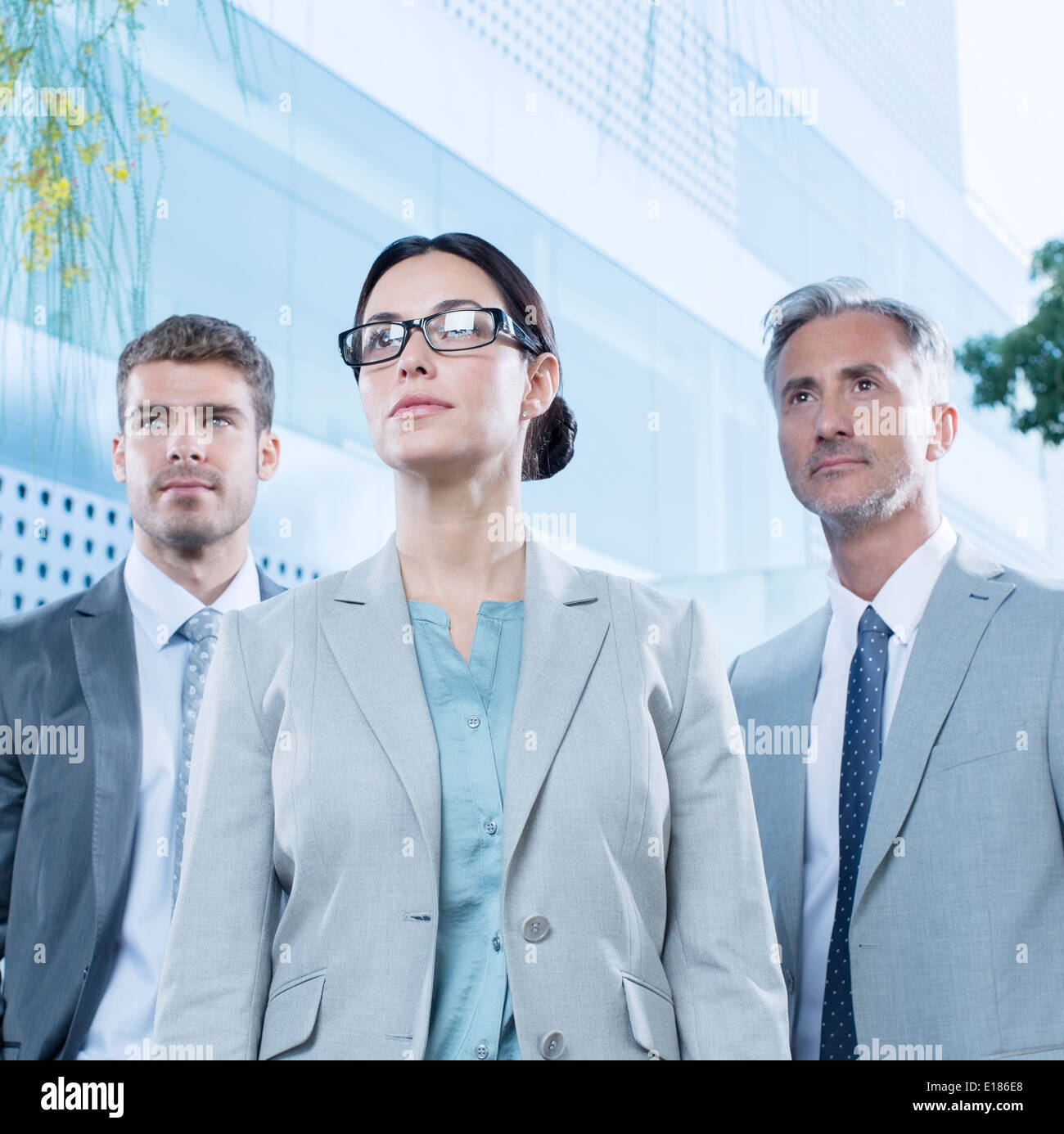 Serious business people outdoors Stock Photo - Alamy