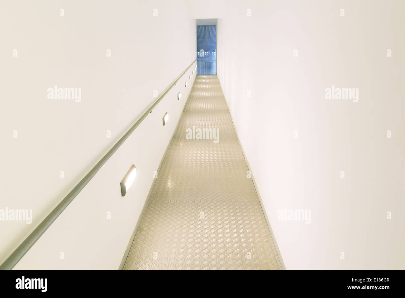 Person standing at top of steep ramp Stock Photo - Alamy