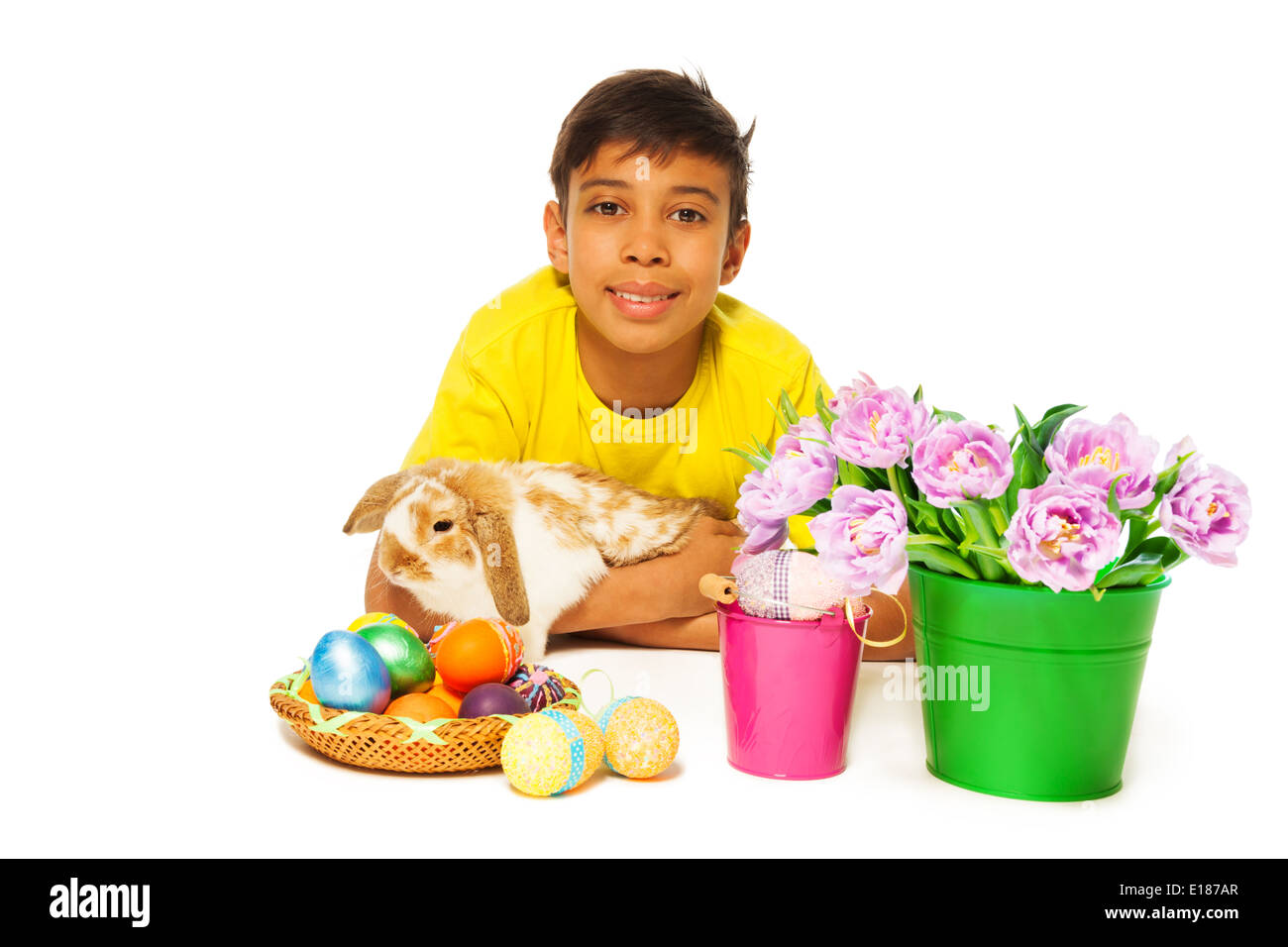 Boy lying and hugging rabbit near Eastern eggs Stock Photo - Alamy
