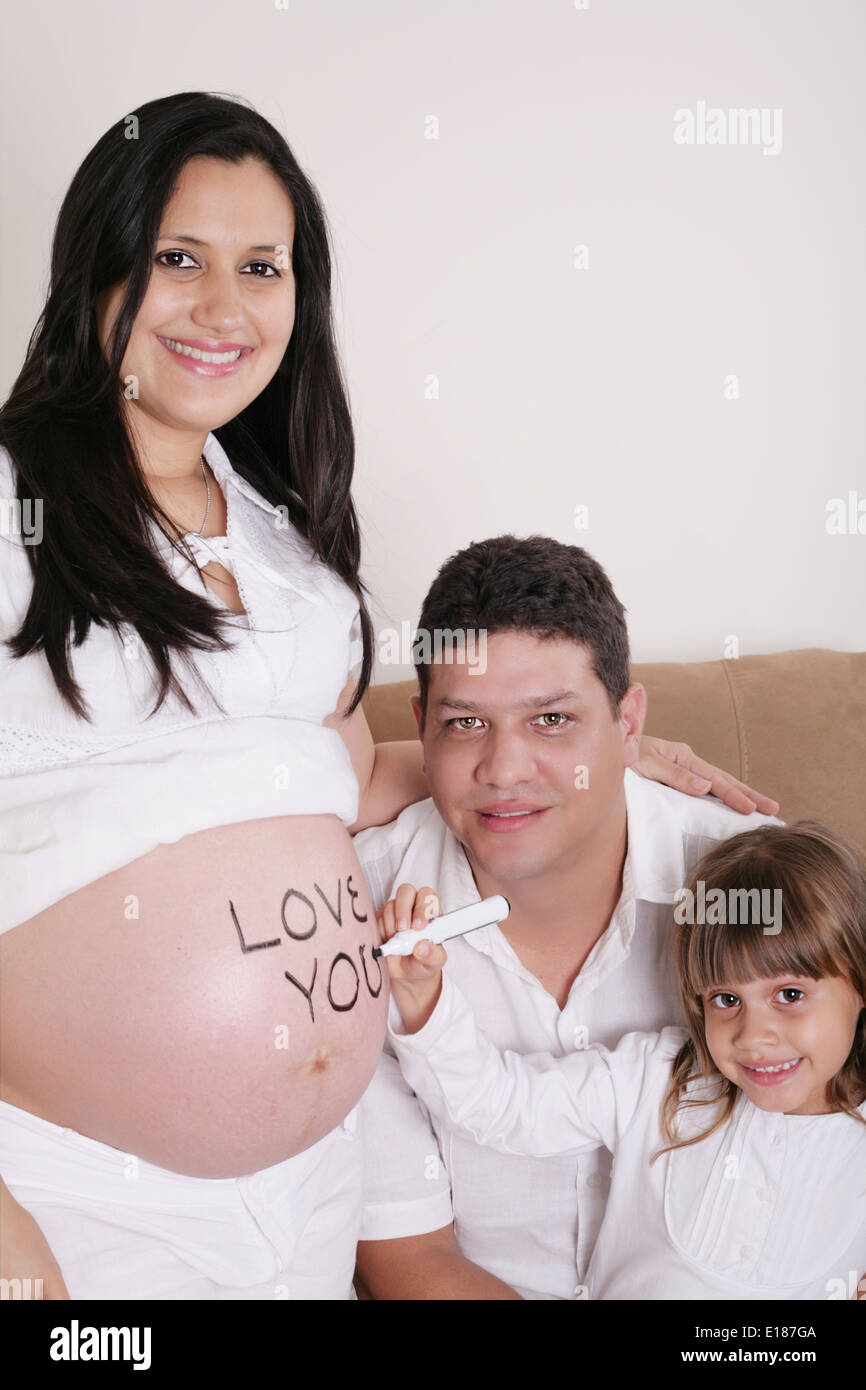 Pregnant mother daughter touching belly hi-res stock photography and ...