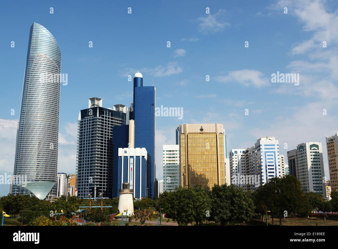 High-rise buildings tower over Family Park in downtown Abu Dhabi Stock ...