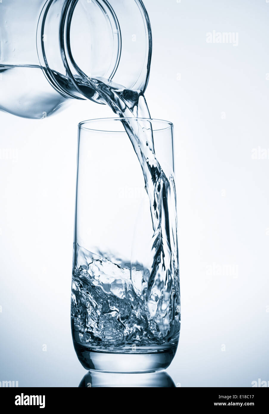 Pitcher of water pouring into glass hi-res stock photography and images ...