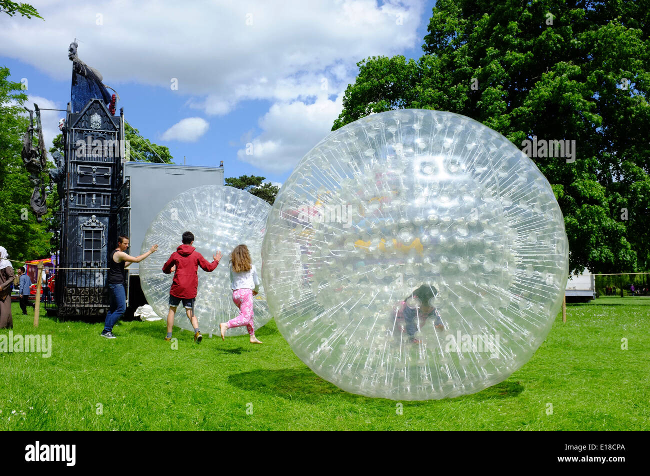 Inflatable ball with children playing inside Stock Photo - Alamy