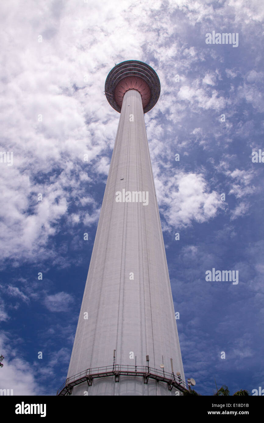 View looking up a cylindrical communications tower from below against a ...