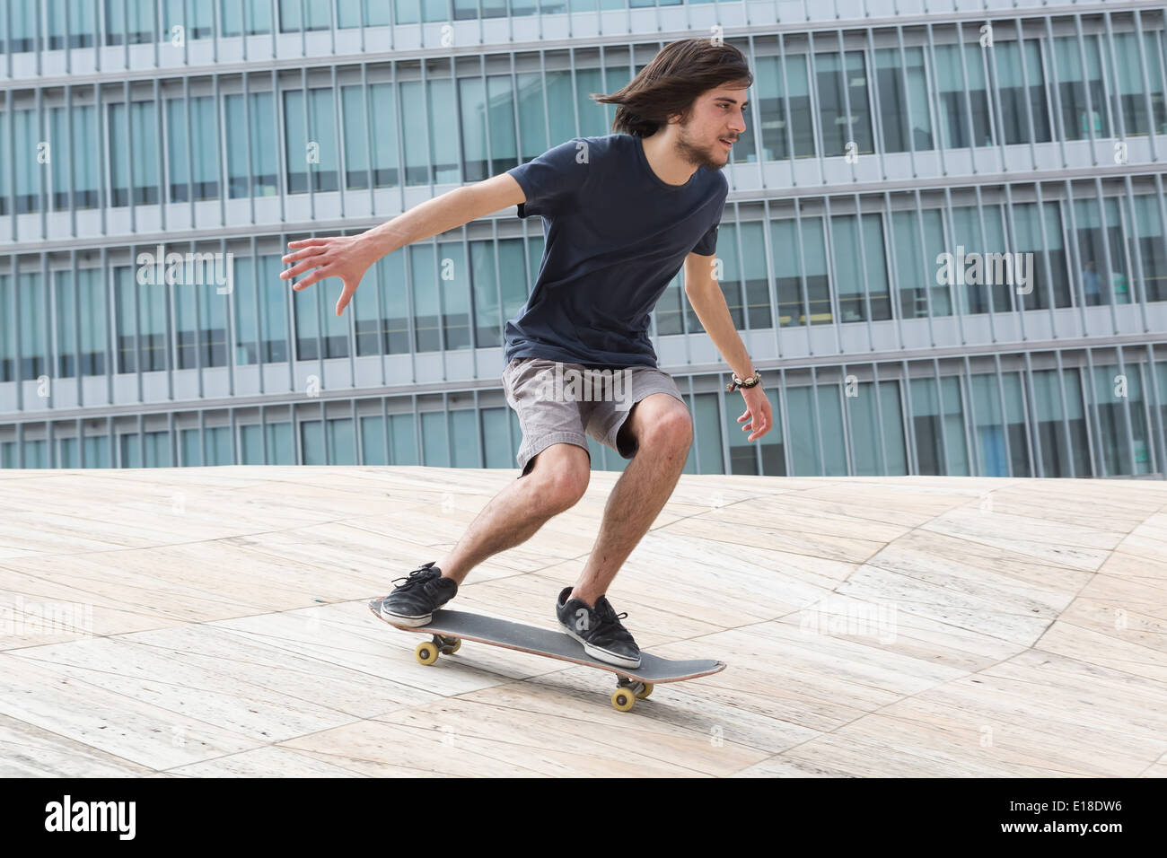 Young boy skateboarder at the local skatepark Stock Photo - Alamy