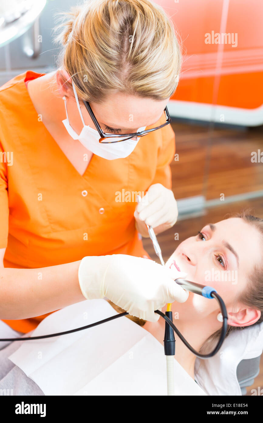 Nurse cleaning teeth hi-res stock photography and images - Alamy
