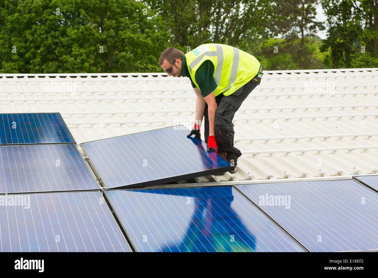 photovoltaic solar panels being installed on a roof Stock Photo - Alamy