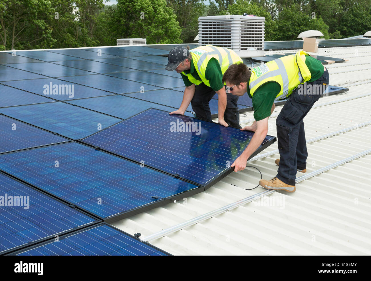 photovoltaic solar panels being installed on a roof Stock Photo - Alamy