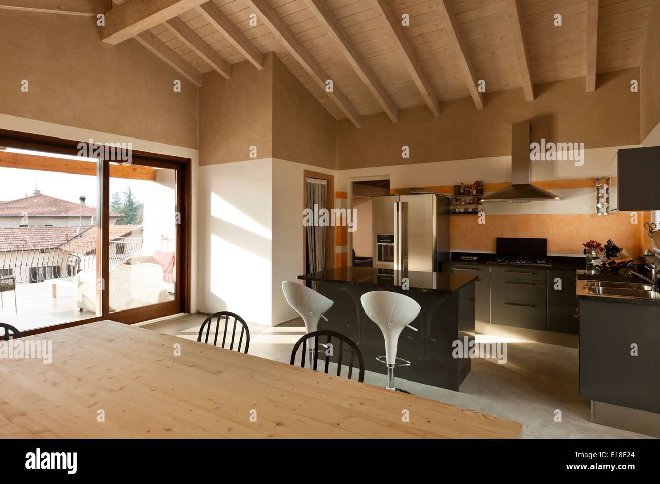 interior, new loft furnished, view of dining table and kitchen Stock ...