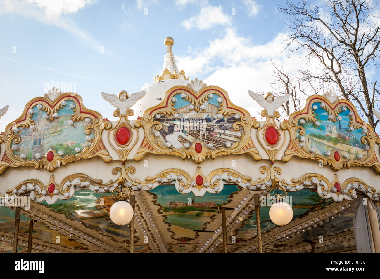 Ornate round painted metal frame of a vintage French carousel or merry ...