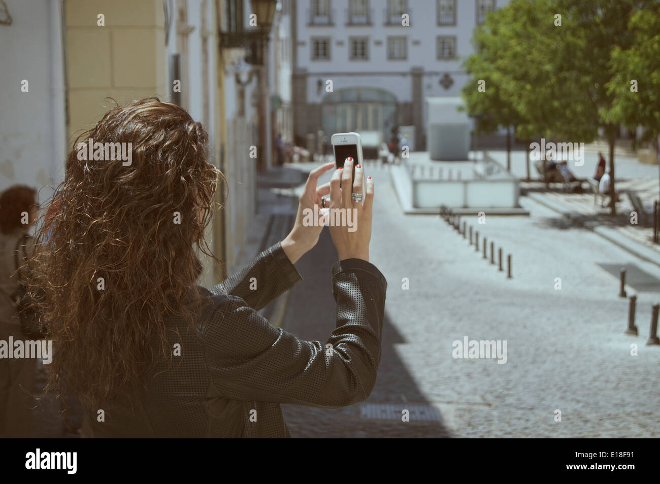 Woman taking a picture Stock Photo - Alamy