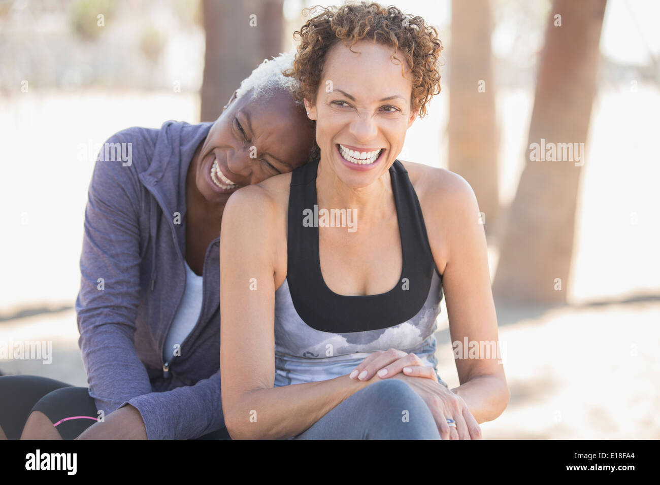Women laughing outdoors Stock Photo - Alamy