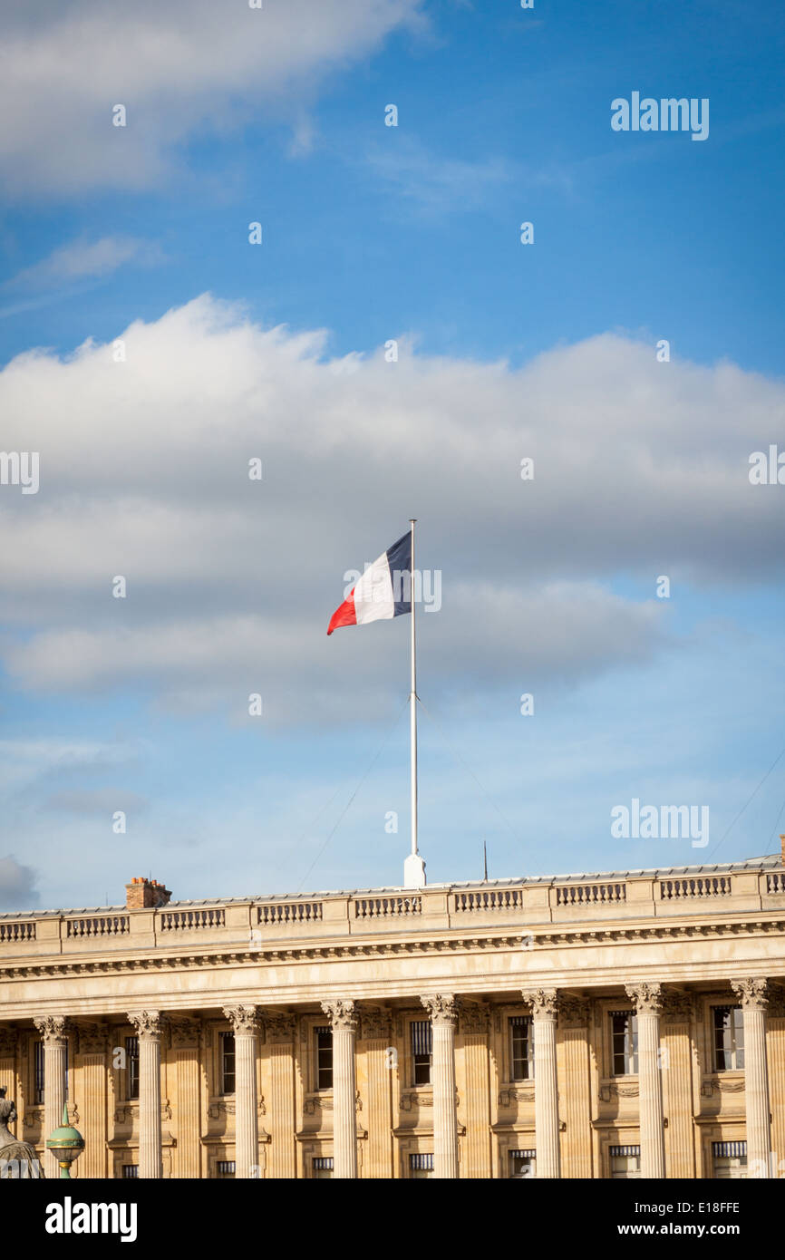Flag of France fluttering on a pole placed on the top of a vintage ...