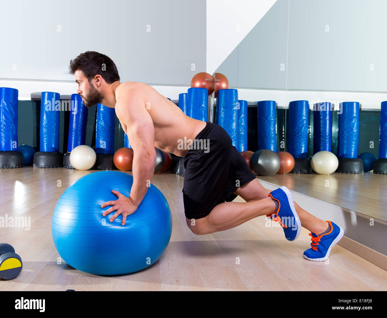 Fitball abdominal push ups Swiss ball man one single leg pushup at ...