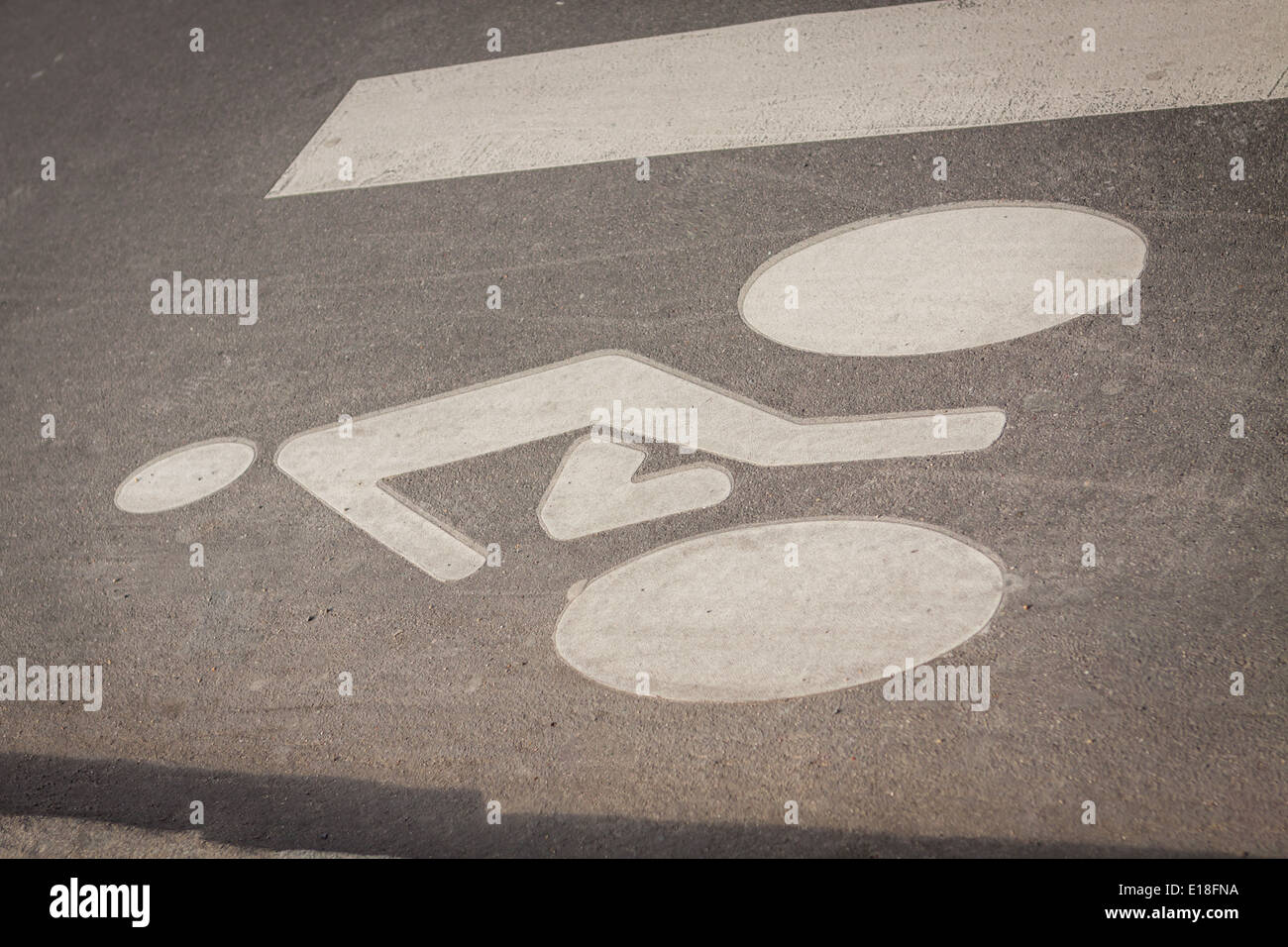 Cyclist road traffic sign painted on a tarred road surface in a bicycle ...