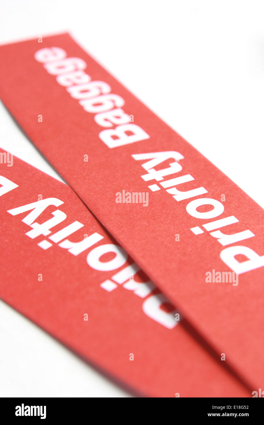 red label "priority" for baggage Stock Photo - Alamy