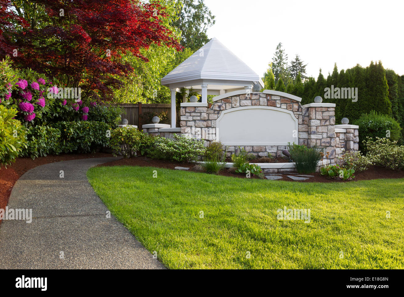 Horizontal evening photo of pathway leading to new white pavilion ...