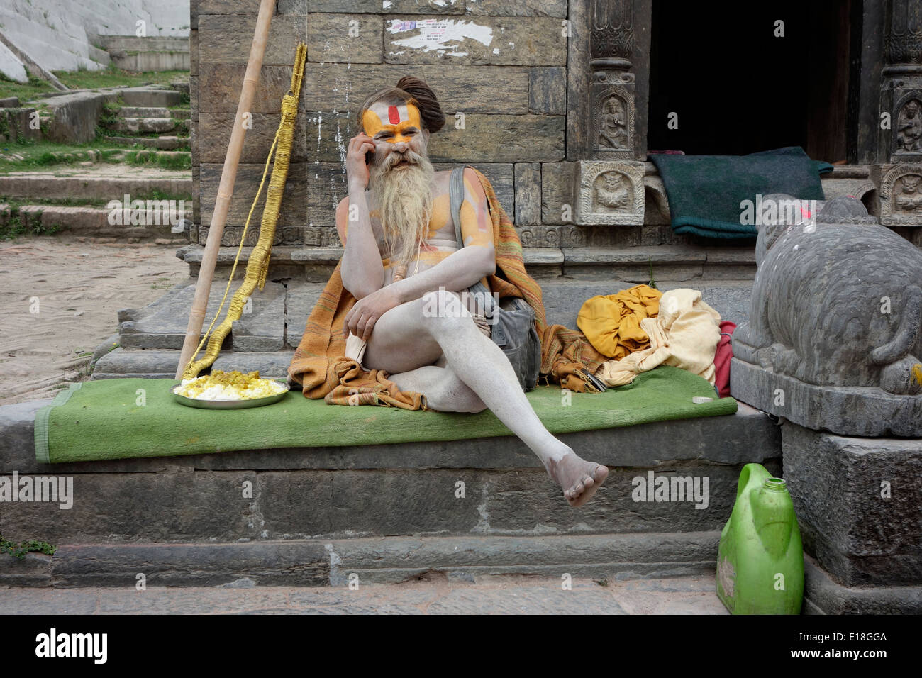 Sadhu ,Hinduism, an ascetic holy man,The Holy Man is talking on cell ...