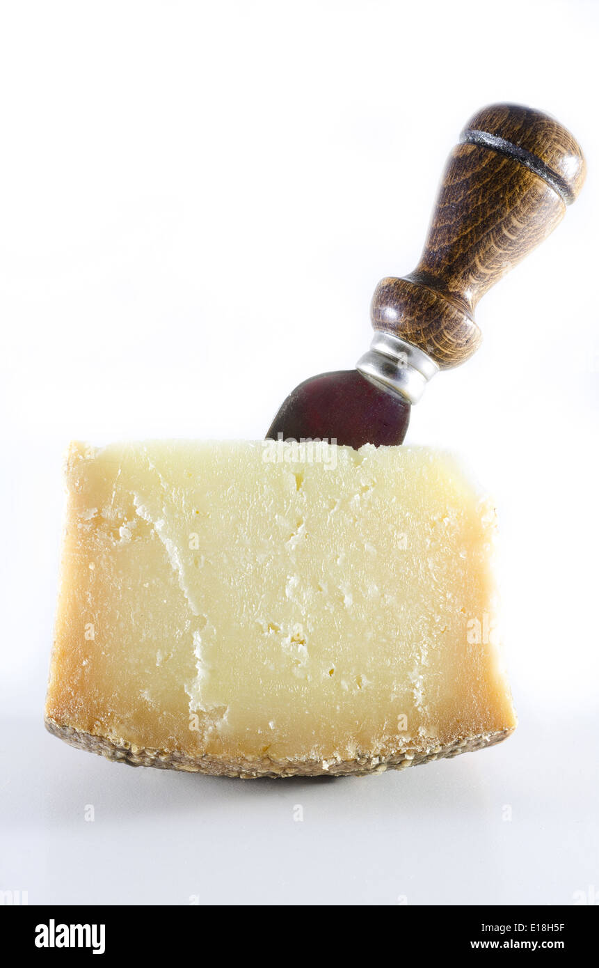 slice of italian sheep cheese and knife Stock Photo - Alamy