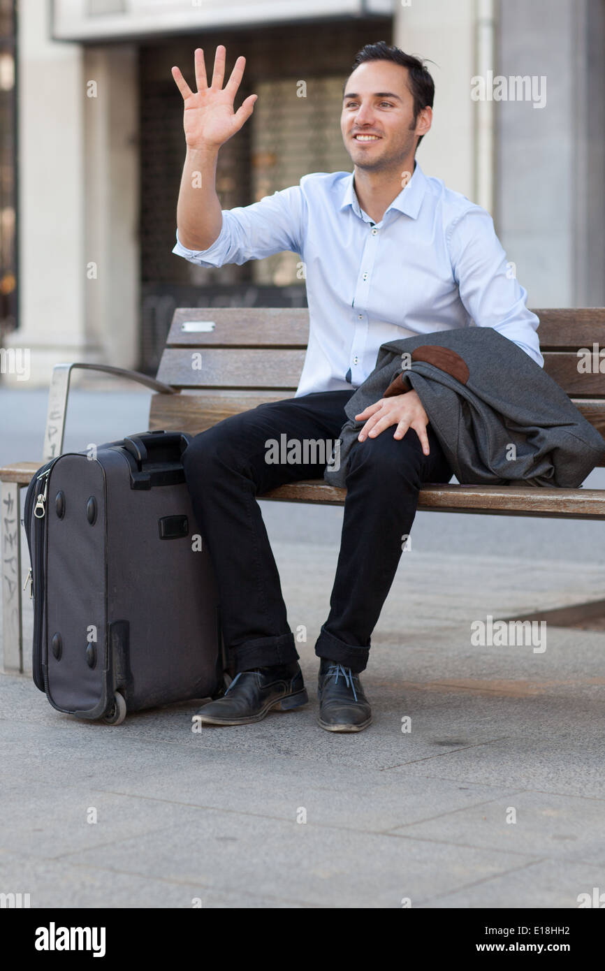 Man waiting on bunch waiting Stock Photo - Alamy
