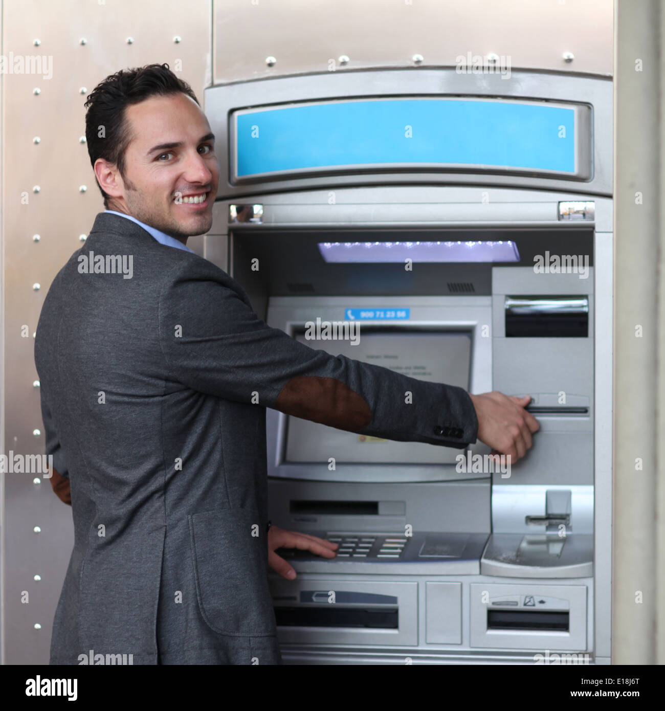 Man at the ATM Stock Photo - Alamy