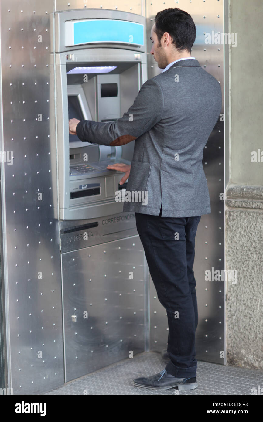 Man at the ATM Stock Photo - Alamy