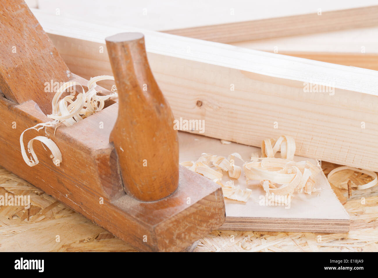 Handheld wood plane with wood shavings Stock Photo - Alamy