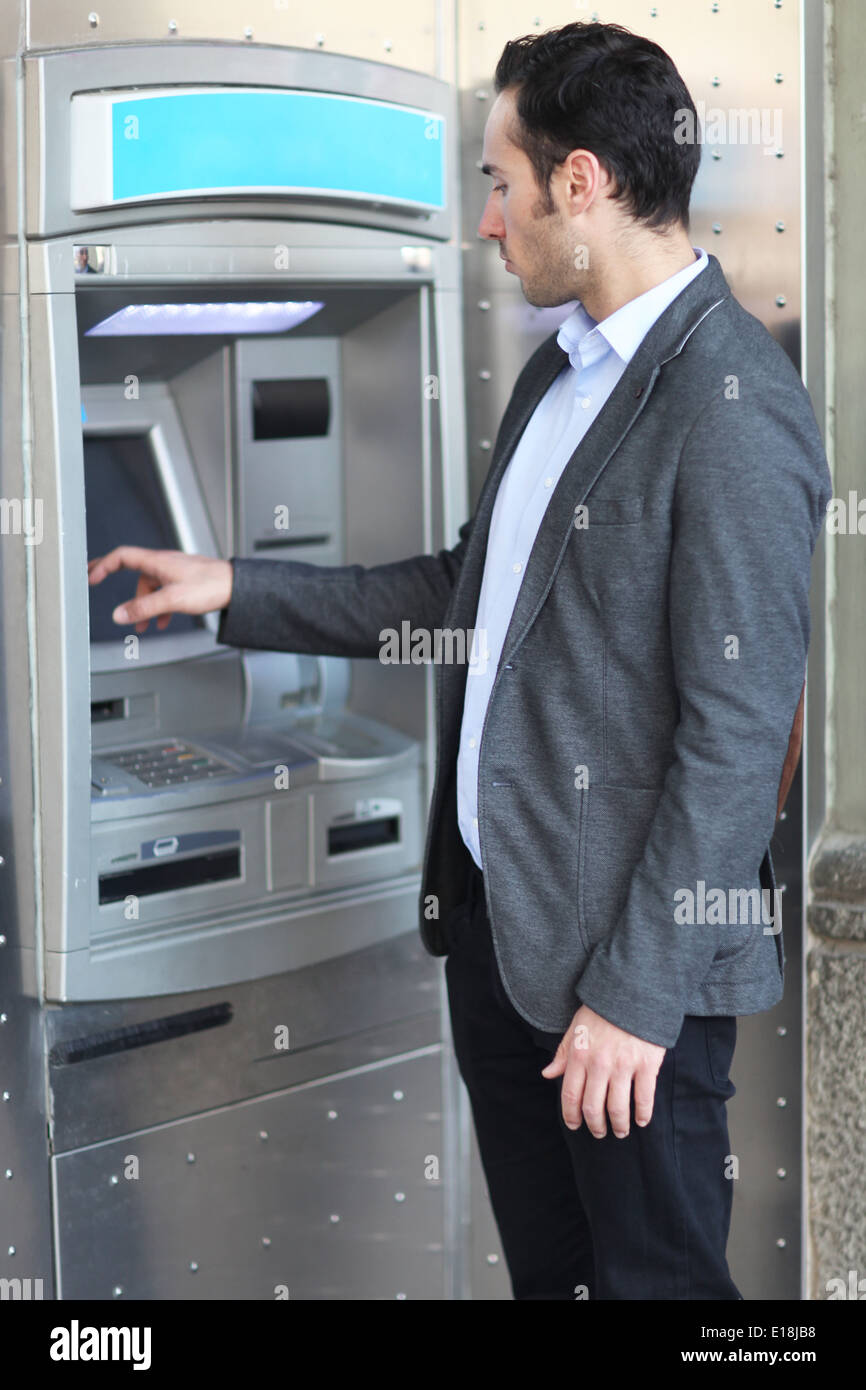 Man at the ATM Stock Photo - Alamy