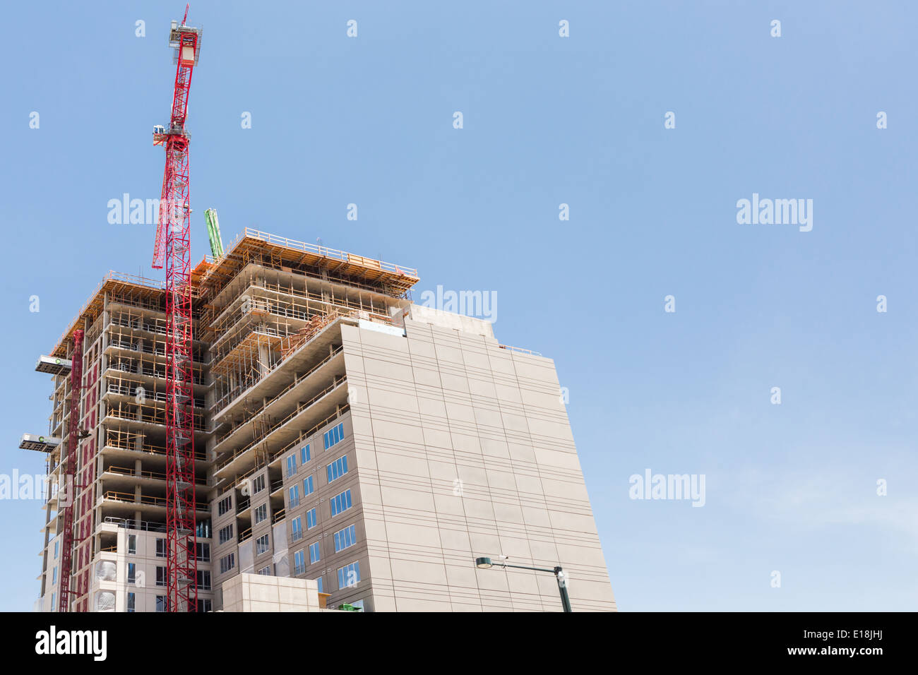 Contemporary condominium building under construction in downtown Denver ...