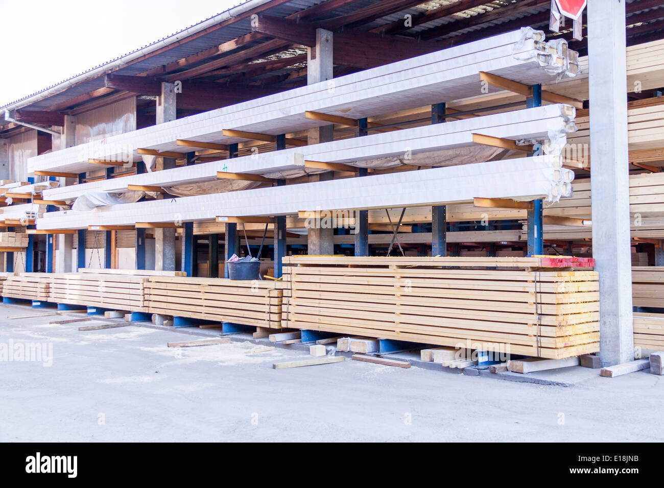 Wooden panels stored inside a warehouse Stock Photo - Alamy