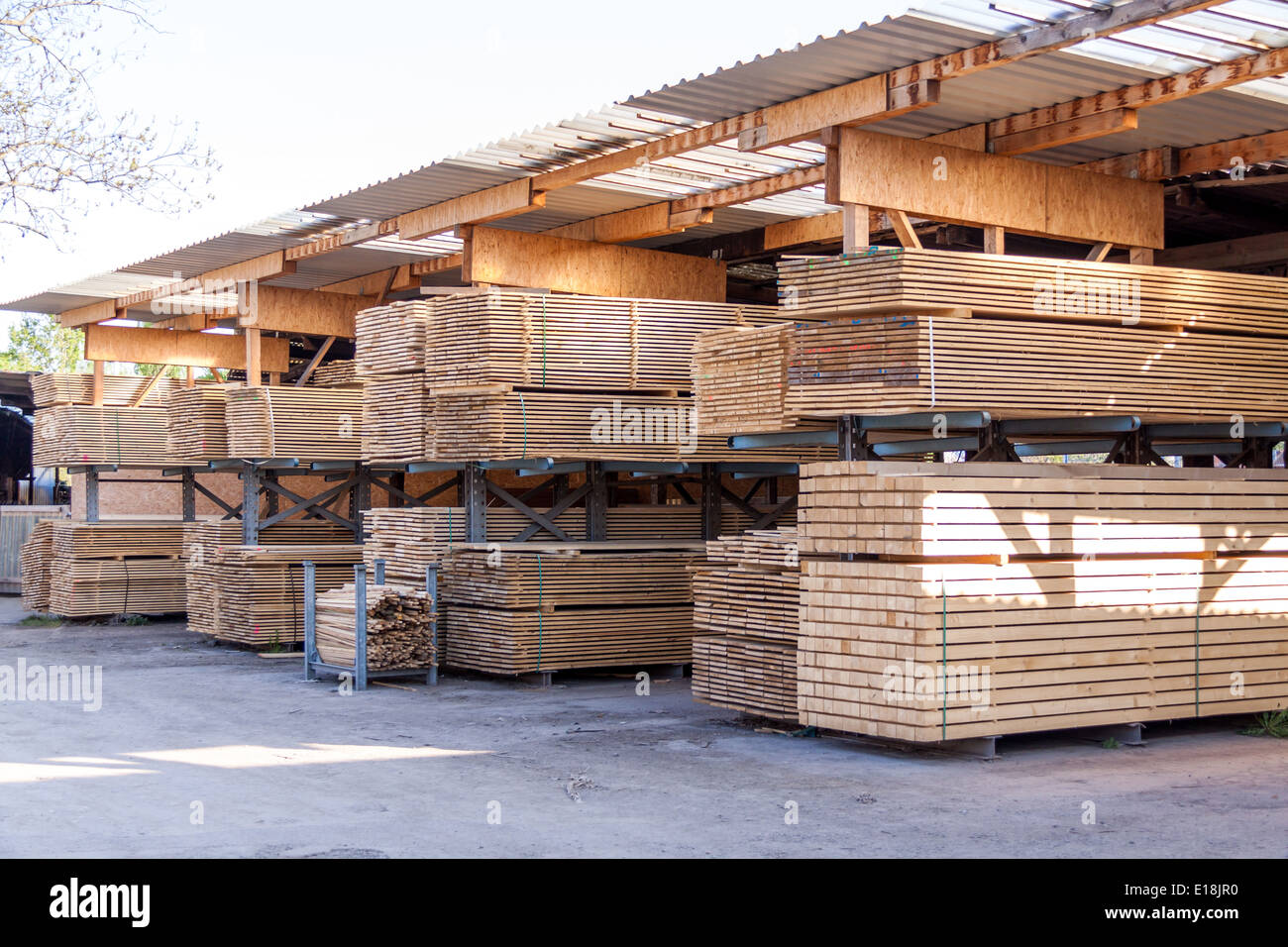 Wooden panels stored inside a warehouse Stock Photo - Alamy