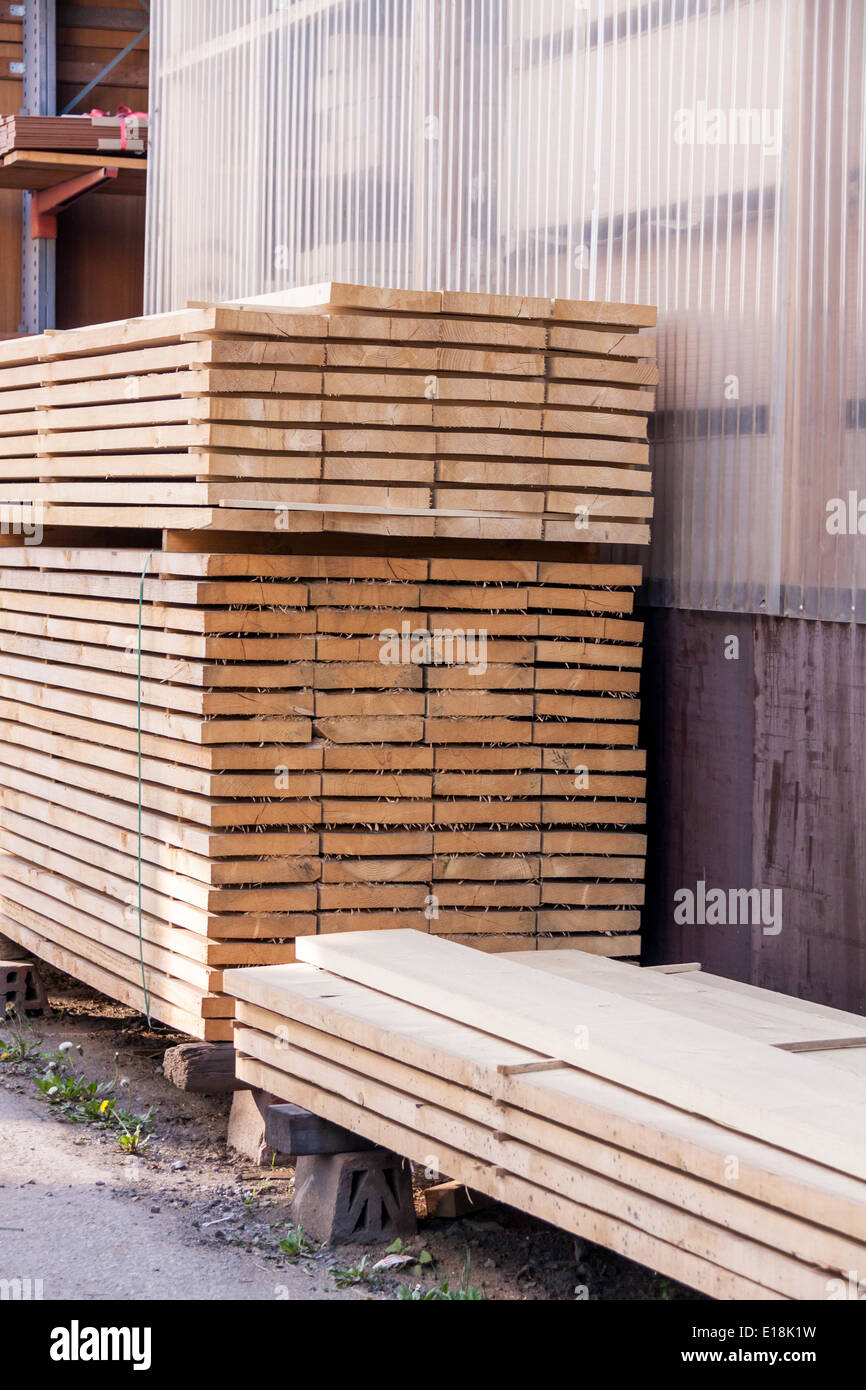 Wooden panels stored inside a warehouse Stock Photo - Alamy