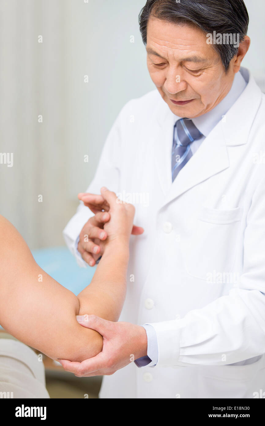 Senior doctor giving massaging Stock Photo - Alamy
