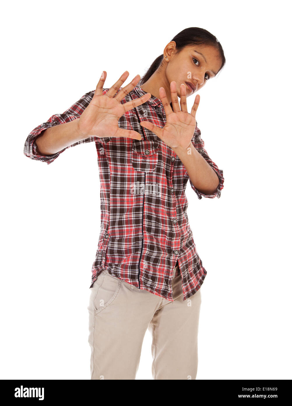 Attractive indian woman with repelling gesture Stock Photo - Alamy