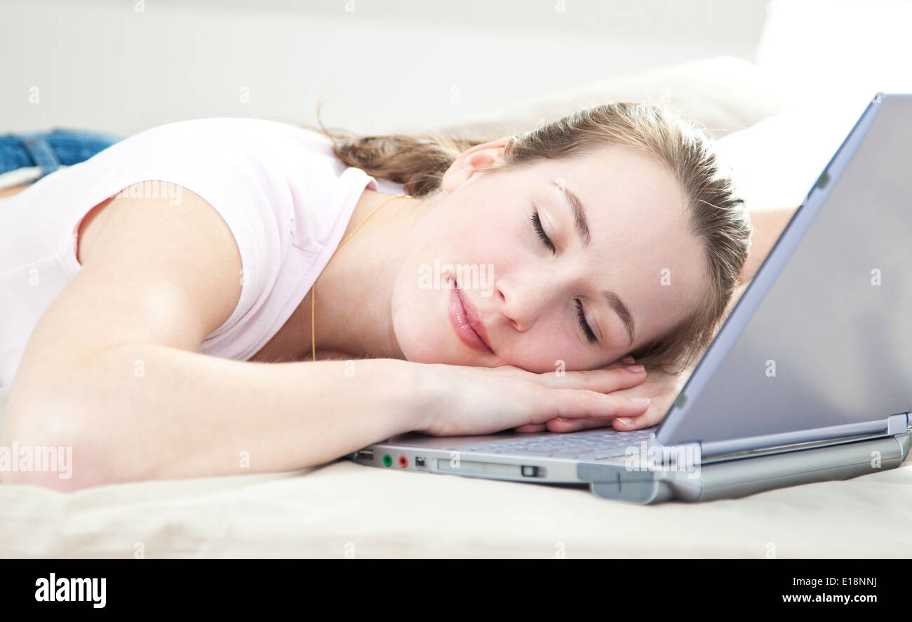 Attractive young woman fell asleep on her laptop computer Stock Photo ...