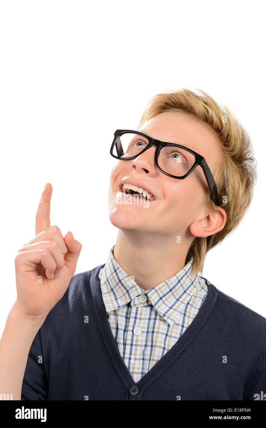 Cheerful boy wearing geek glasses having idea against white background ...