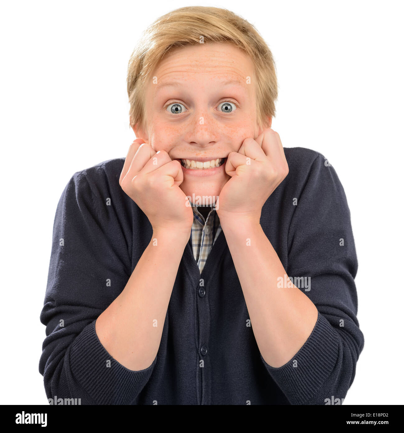 Excited teenage boy standing against white background Stock Photo - Alamy