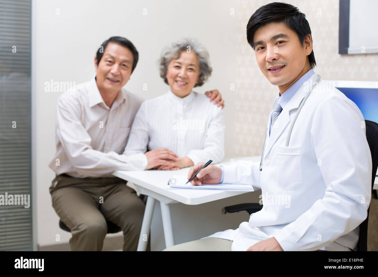 Doctor arm over shoulder hi-res stock photography and images - Alamy