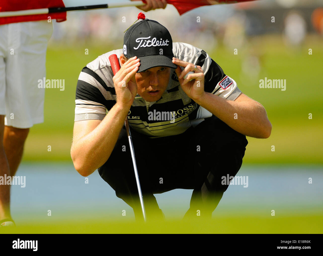 Nick Watney from America lines up a putt at the Australian Golf Open ...