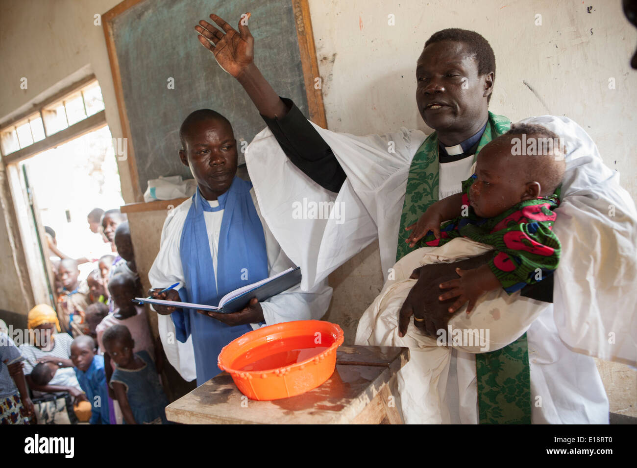 Infant baptism priest hi-res stock photography and images - Alamy