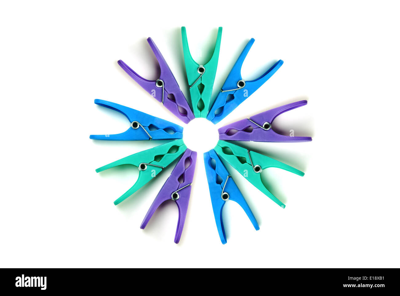 Coloured plastic clothes pegs on a white background Stock Photo - Alamy