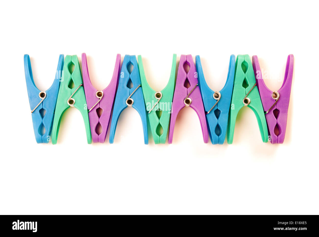 Coloured plastic pegs Cut Out Stock Images & Pictures - Alamy