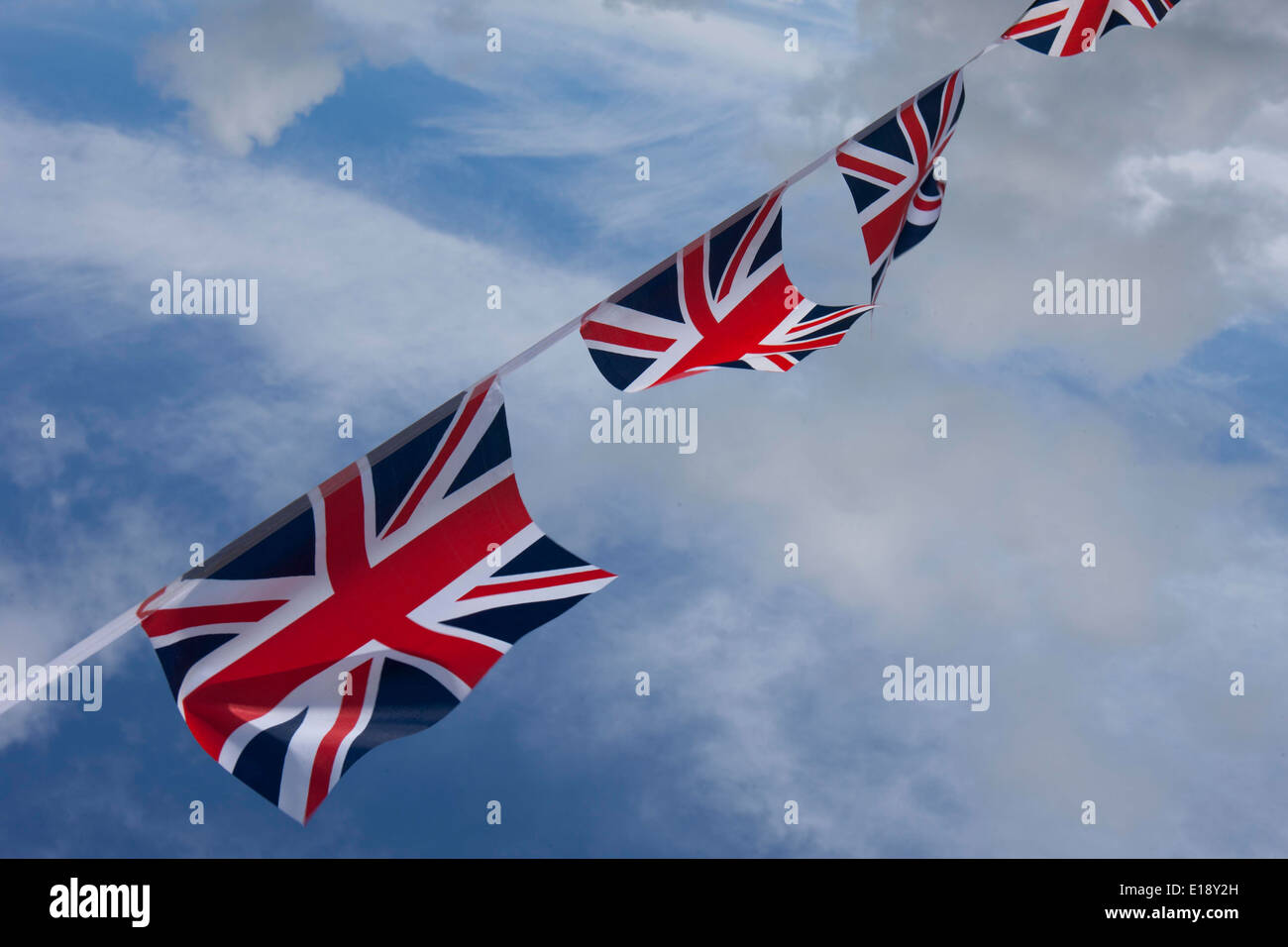 Union Jack Bunting flying on a windy spring day Stock Photo - Alamy