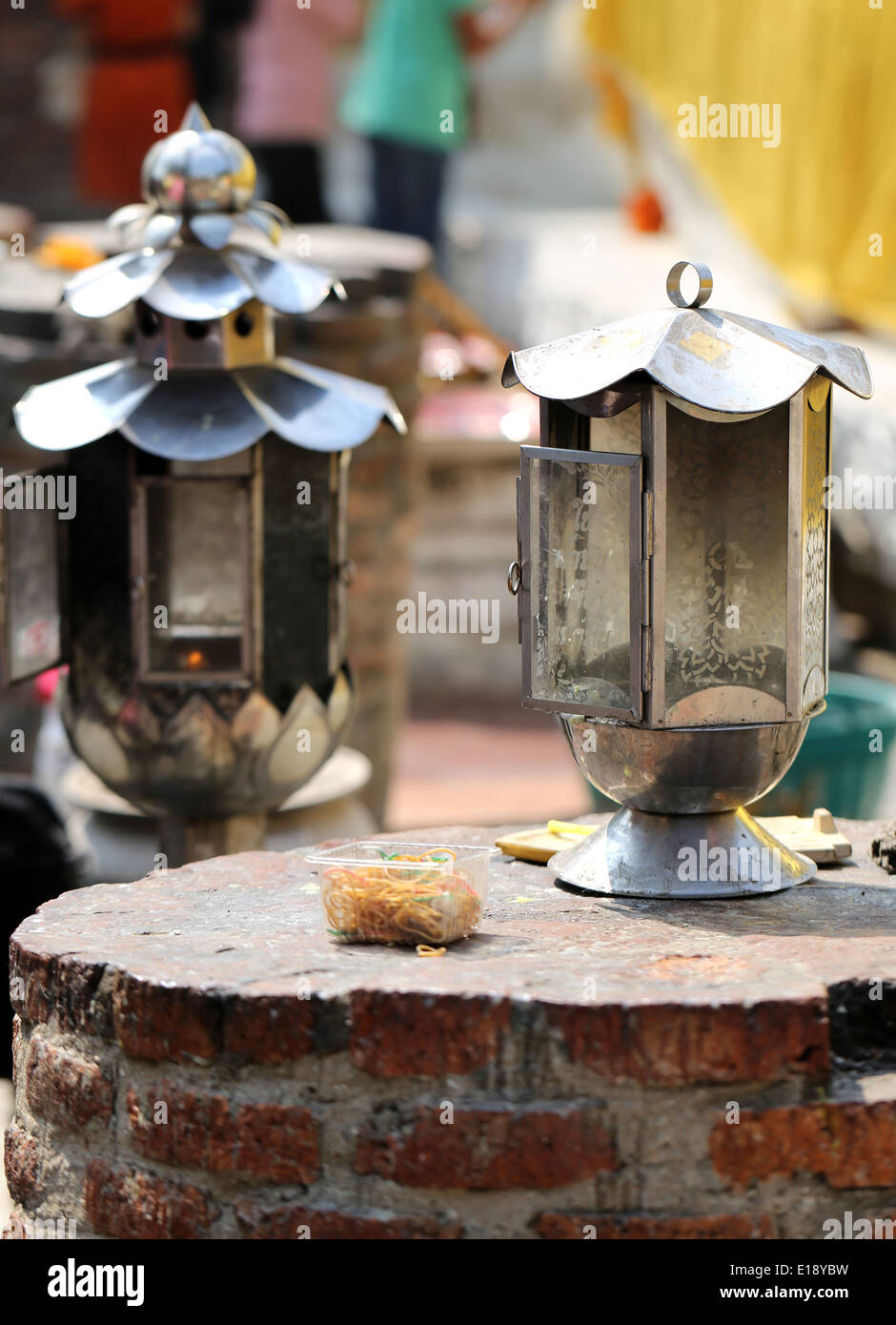 Street lamp stands on a brick table against the background of another ...