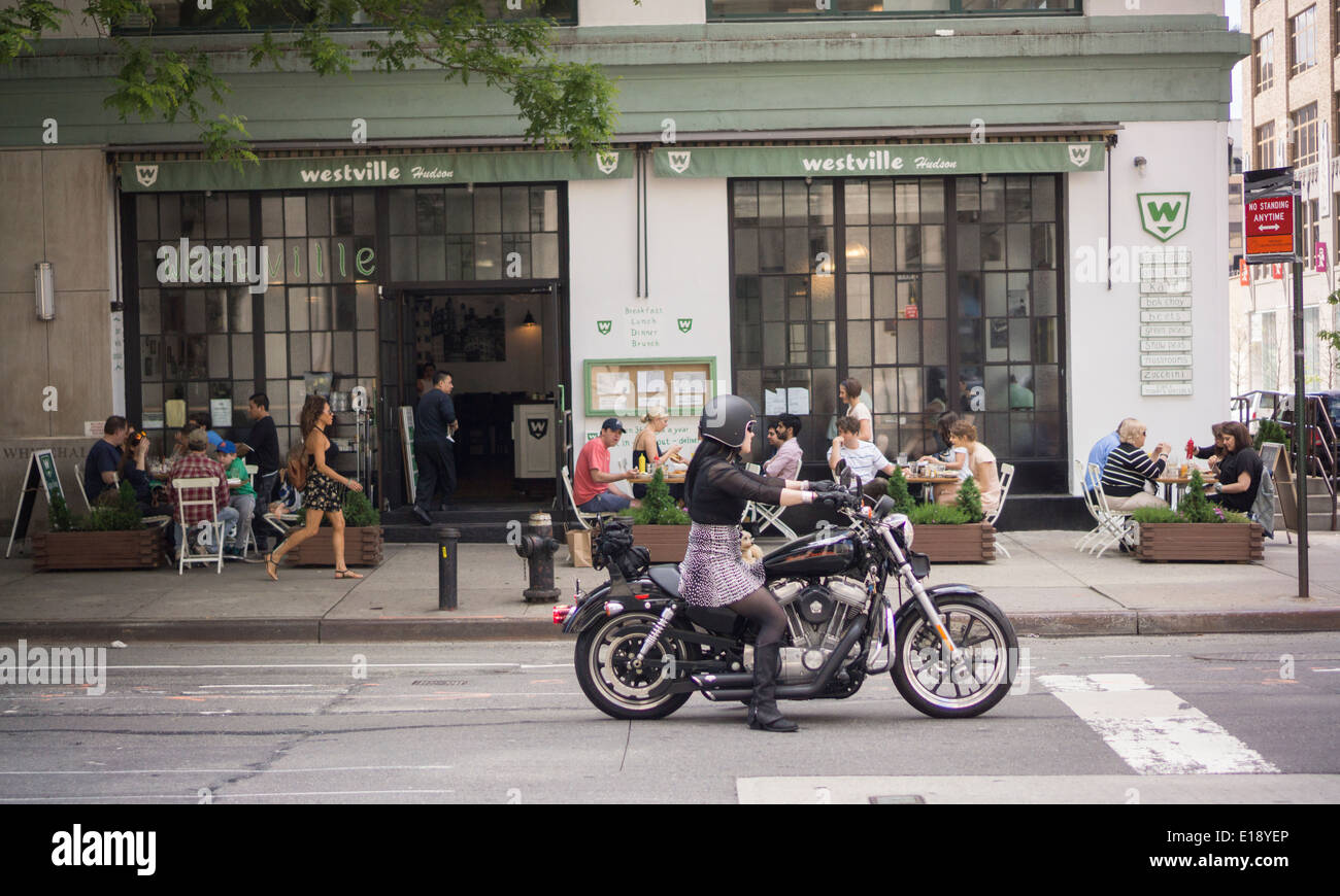 A motorcyclist outside al fresco dining in the Hudson Square ...