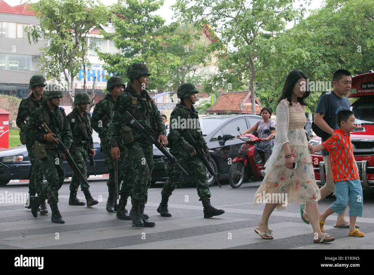 Chiang Mai, Thailand. 27th May, 2014. Soldiers and a Thai family ...