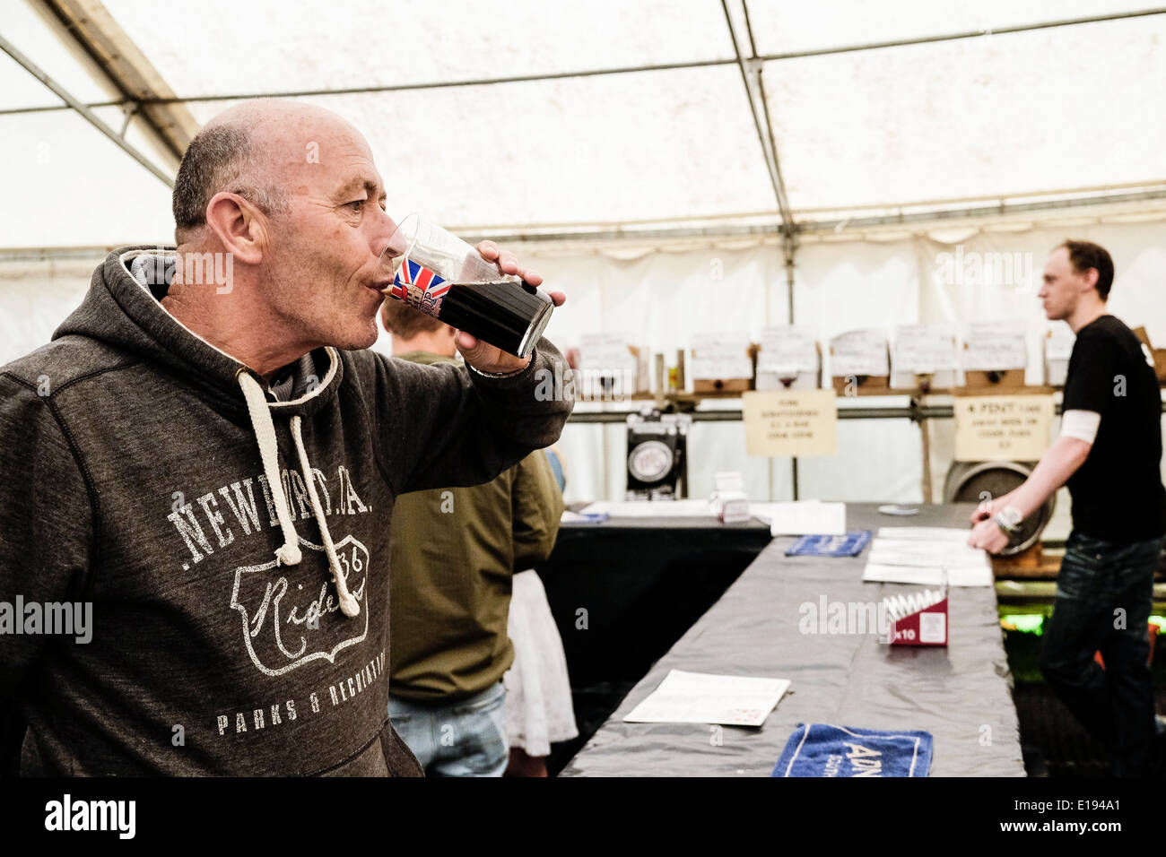 A customer enjoying a pint of real ale at the Hoop Beer Festival Stock ...