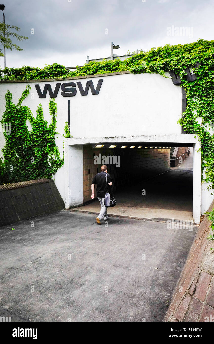 A pedestrian walking through an underpass Stock Photo - Alamy