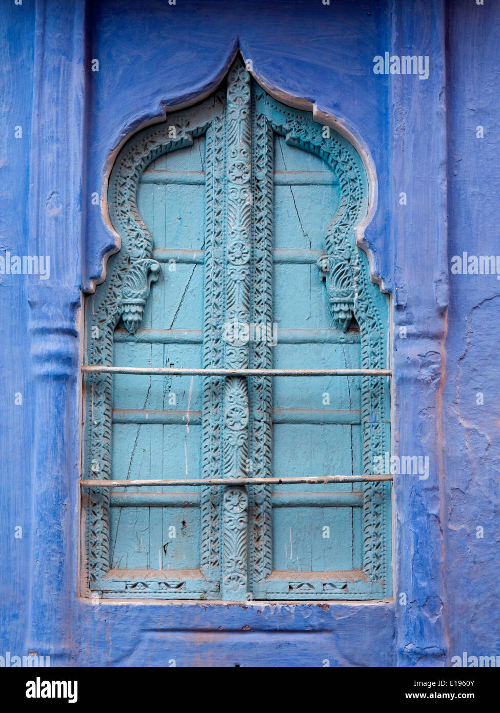 India, Rajasthan, Jodhpur, carved moghul arched window of of blue ...
