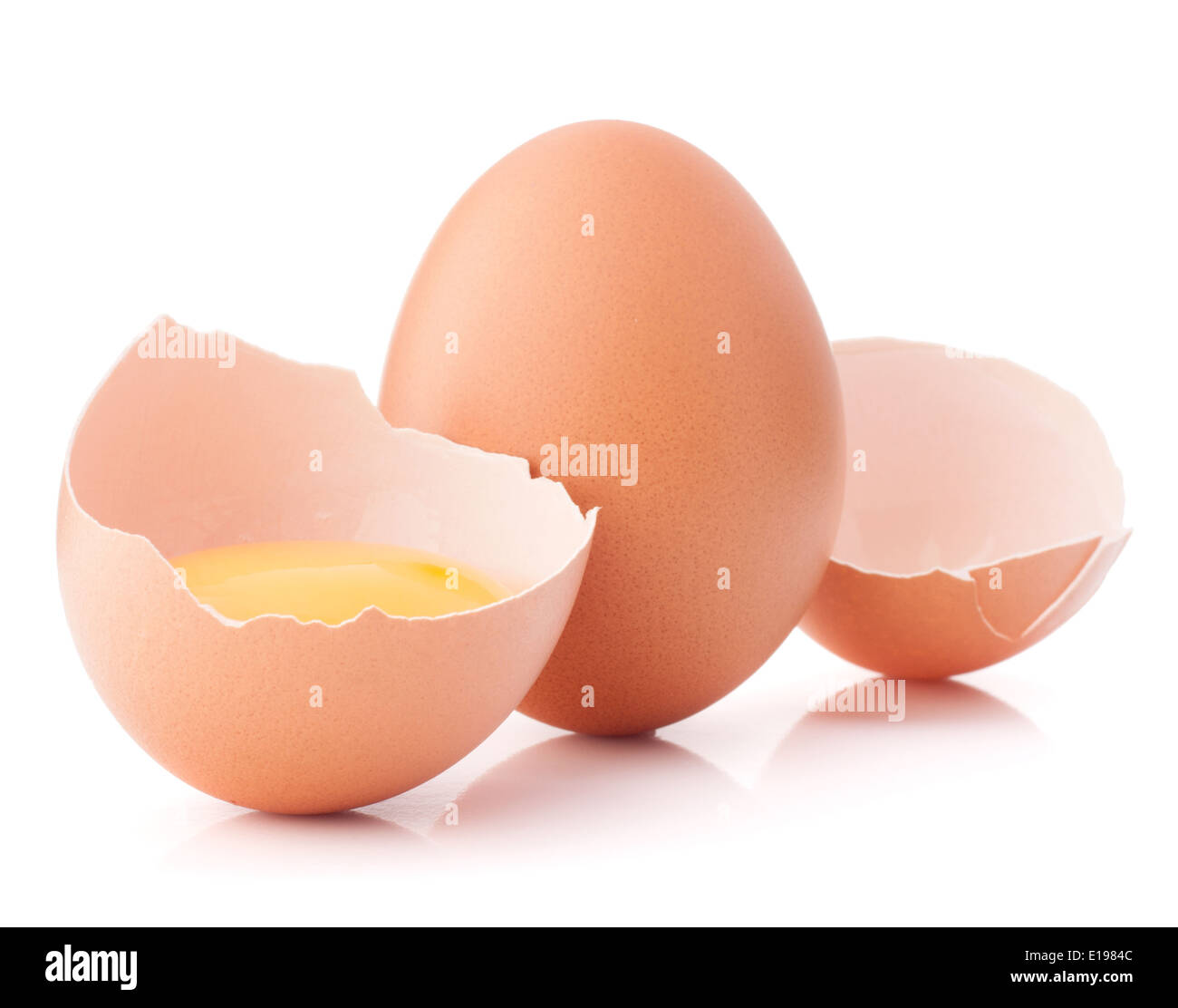 Breaking egg isolated on white background cutout Stock Photo - Alamy